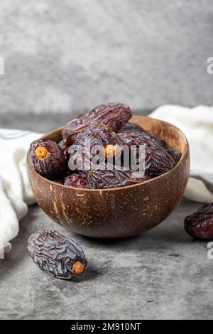 Jerusalem date fruit on stone background. Huge date fruit in a coconut ...