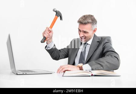 overworked boss hitting laptop with hammer in office Stock Photo - Alamy