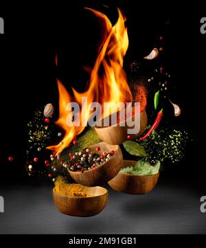 Hot Spices and seasonings powder splash, explosion on black background ...