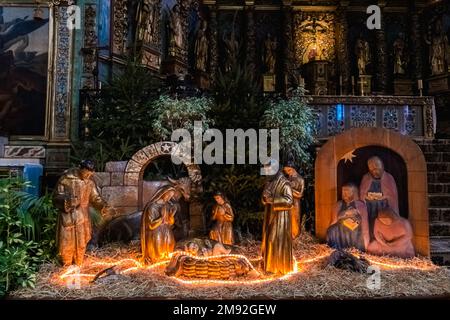 Figures of a classic nativity scene decorated with beautiful artistic ...