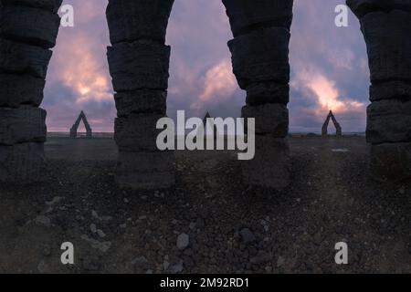 Silhouette of Artic Henge located in Iceland under bright sunset cloudy ...