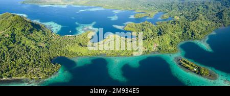 Coral reefs fringe convoluted, tropical islands found in a remote part ...