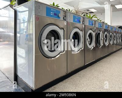 Coin laundry shop with washing machines Stock Photo - Alamy