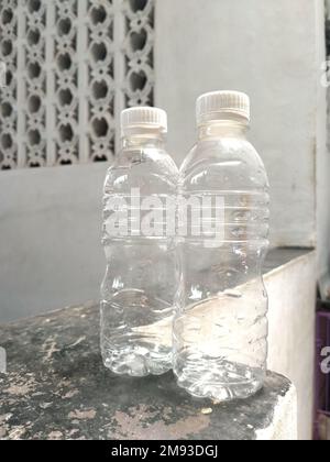 empty plastic bottle with drops on white background Stock Photo - Alamy