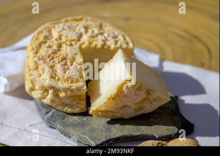 Tasting of local portuguese matured cheese queijo serpa, Setubal area ...