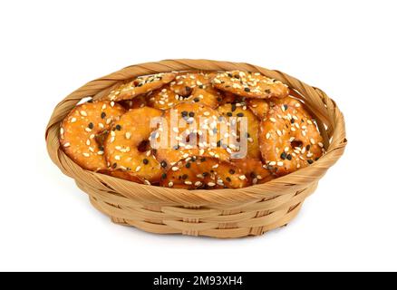 Salted round pretzels with black and white sesame isolated on white ...