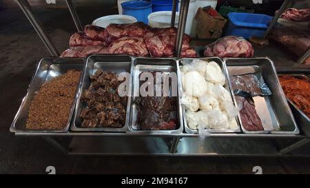 Butcher shop in Mexico with different types of meat on trays. Typical ...