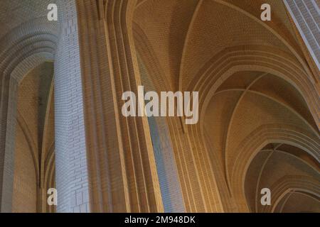 Detail of cream brick vault, arch, rib wall, column and clerestory ...