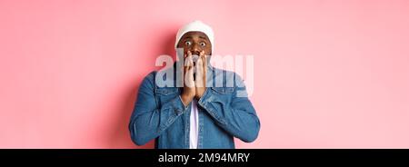 Alarmed and worried Black man staring at bad accident, gasping and ...