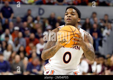 Auburn guard K.D. Johnson (0) shoots as Colgate guard Braeden Smith (2 ...