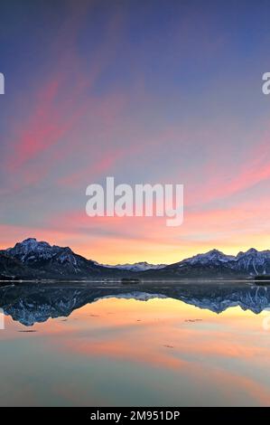 Sunset at the Forggensee with view of the Saeuling near Fuessen ...