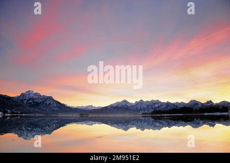 Sunset at the Forggensee with view of the Saeuling near Fuessen ...