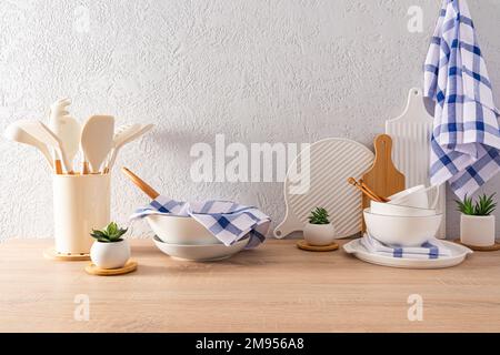 Kitchen utensils on concrete countertop Stock Photo - Alamy