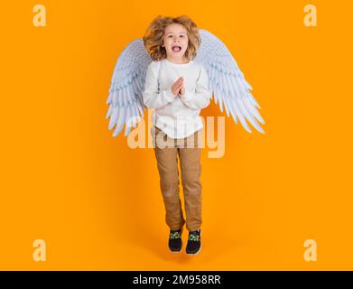 Excited little angel, amazed kids. Kid wearing angel costume white ...