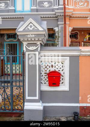 Decorative pier capping of fence in front of Peranakan shophouse on ...