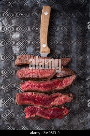 Different degrees of steak roasting. Steak with blood, medium to high ...