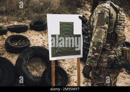 Soldier marking the target for shooting Stock Photo - Alamy