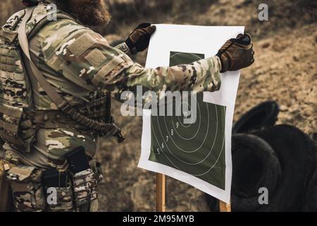 Soldier in camouflage having shooting training Stock Photo - Alamy