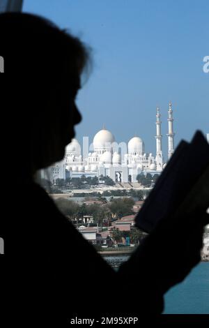Silhouette of a Muslim woman reading the Holy Quran. Sheikh Zayed Grand ...