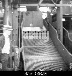 Sorting coal at a coal mine Stock Photo - Alamy