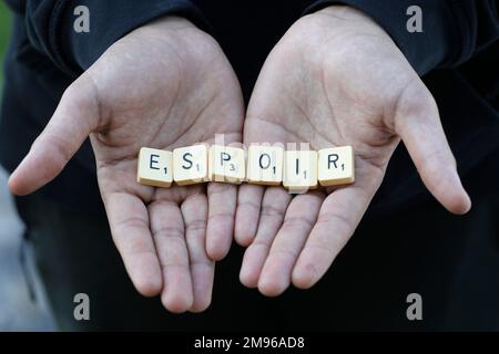 Boy showing letters spelling hope in Eure, France Stock Photo - Alamy