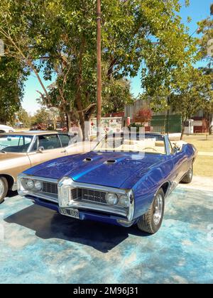 Old blue sport Pontiac GTO two door convertible 1969 in the countryside ...