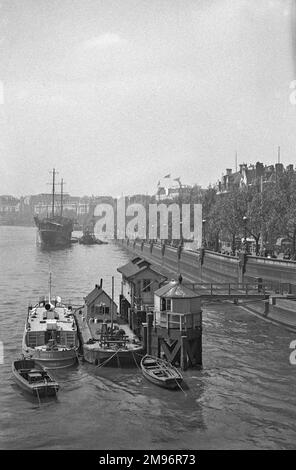 Transport on the River Thames, London, England. Thames lightermen with ...