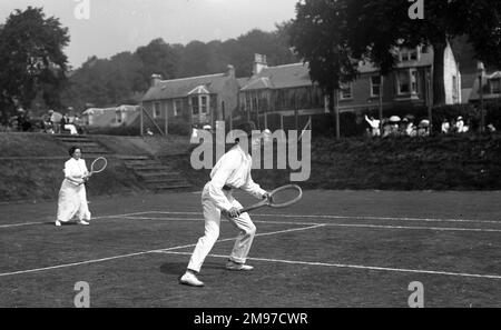 Edwardian tennis match of mixed doubles Stock Photo - Alamy