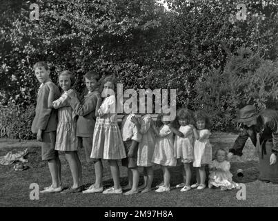 Family in line Stock Photo - Alamy