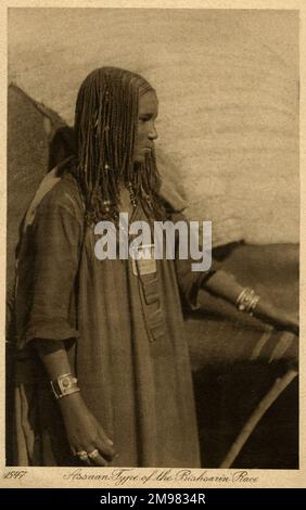 Egypt. Aswan. Woman of Nubian tribe in traditional dress in front of ...