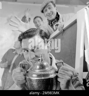 Advertisement for Silvikrin hair products -- three male models (Derek ...