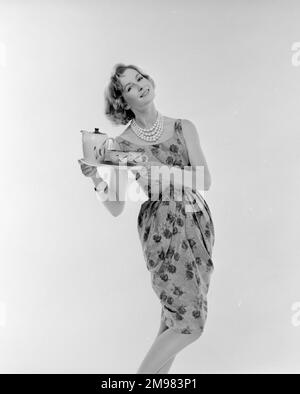 Advertisement for Nescafe -- female model (Sandra Paul) with tray Stock ...