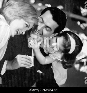 Advertisement for Remington shavers -- three models posing as a happy ...