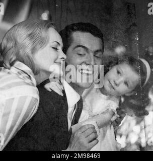 Advertisement for Remington shavers -- three models posing as a happy ...