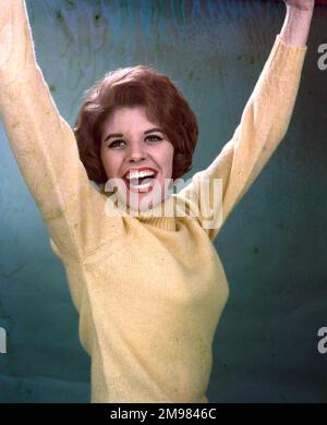 Advertisement for Pepsodent toothpaste -- female model wearing a yellow ...