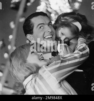 Advertisement for Remington shavers -- three models posing as a happy ...