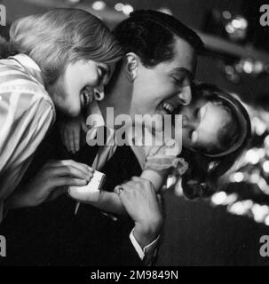 Advertisement for Remington shavers -- three models posing as a happy ...