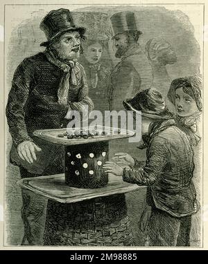 A hat seller selling top hats in Victorian Spitalfields Market near ...