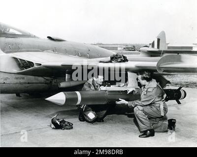 A de Havilland Firestreak air-to-air missile being loaded onto the ...