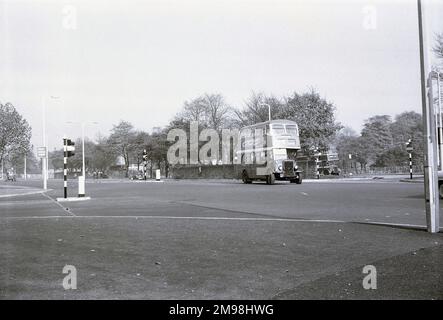 1950s, historical, a bus on the Wilmslow Rd, apoaching the junction at ...