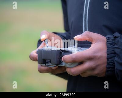 Cheerful young teengaer african american dressed in sportswear flying a ...