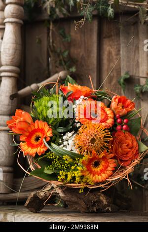 Colorful flower boquet with old wooden spinning wheel Stock Photo - Alamy