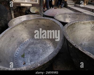 Copper ware shop with crockery, pots and pans in the metal work part of ...