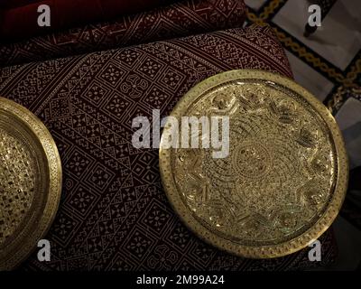 Metal craftsman making copper trays in Fes Morocco Stock Photo - Alamy