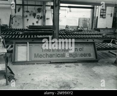 Photograph of the casting of a name plate for a locomotive named 'The ...