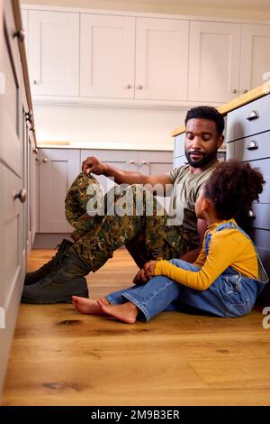 Daughter Comforting Depressed Father In Uniform Suffering With PTSD ...