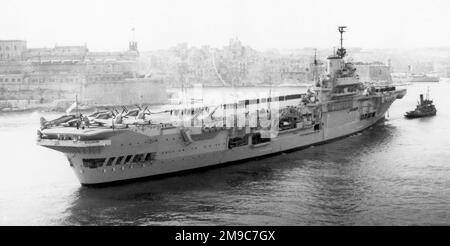 Royal Navy - HMS Indomitable 92, a modified Illustrious-class aircraft carrier, in December 1945 ...