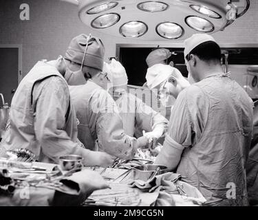 1960s SURGEONS OPERATING PERFORMING MEDICAL SURGICAL PROCEDURE Stock ...