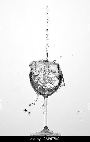 Backlight shot water in glass, air bubbles, white background Stock ...