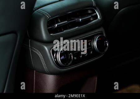Modern car. Digital second row seat temperature control. Car air ...